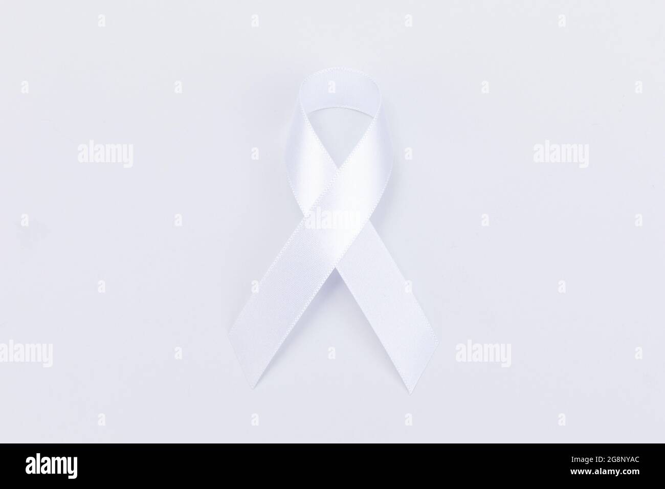 White ribbon on white background Stock Photo - Alamy