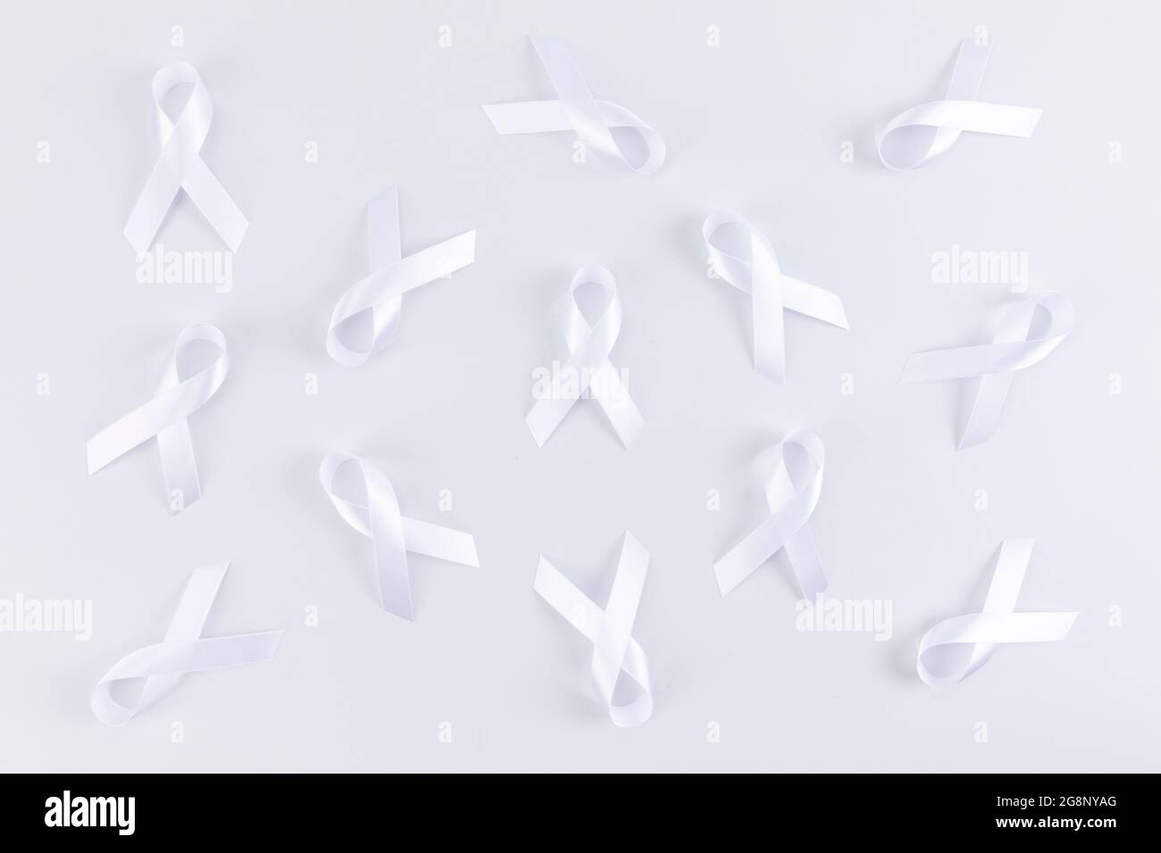 White ribbons on white background Stock Photo - Alamy