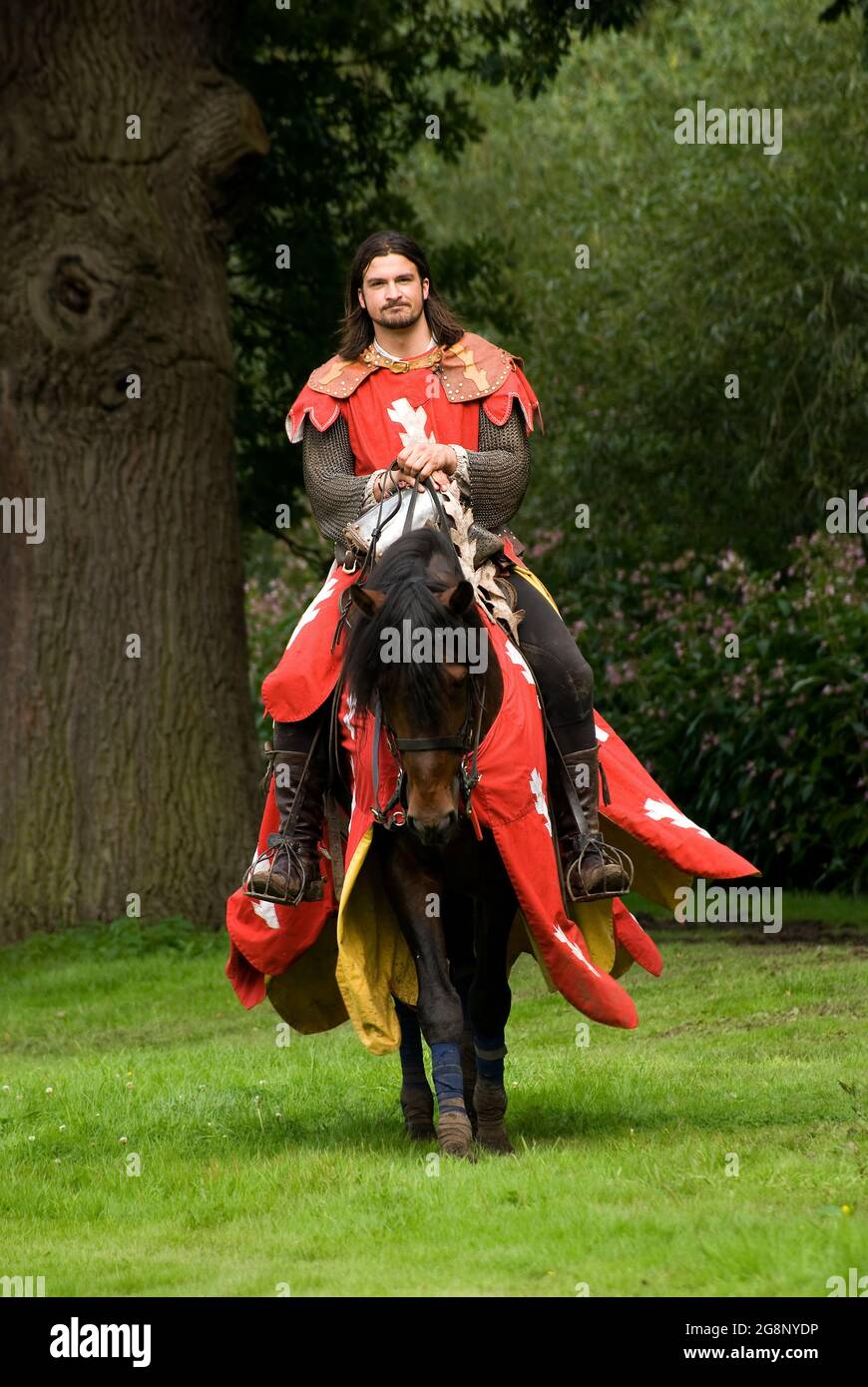 Medieval Knight On Horseback During A Reenactment At Warwick Castle ...