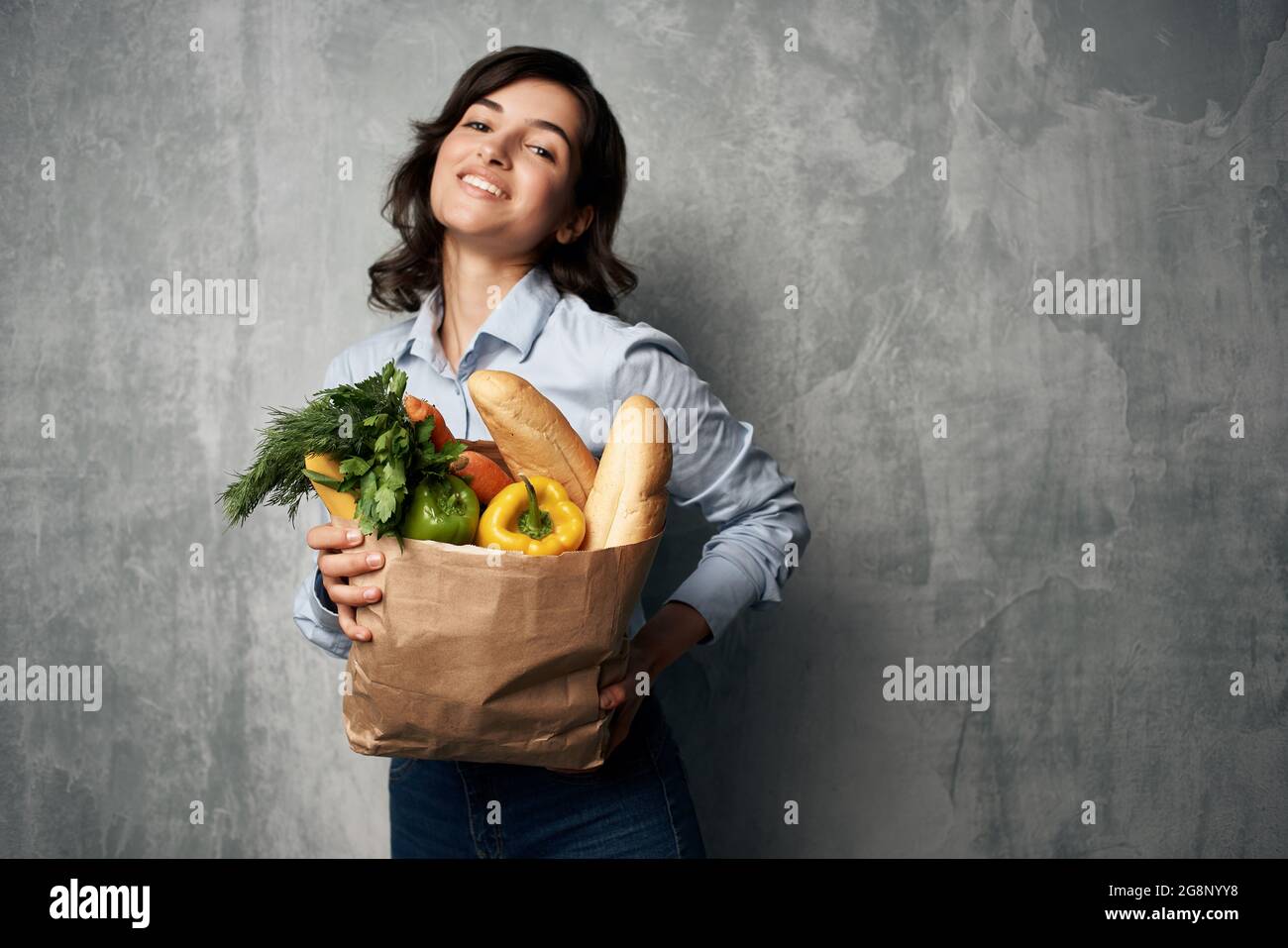 woman with package of groceries supermarkets healthy food service Stock ...