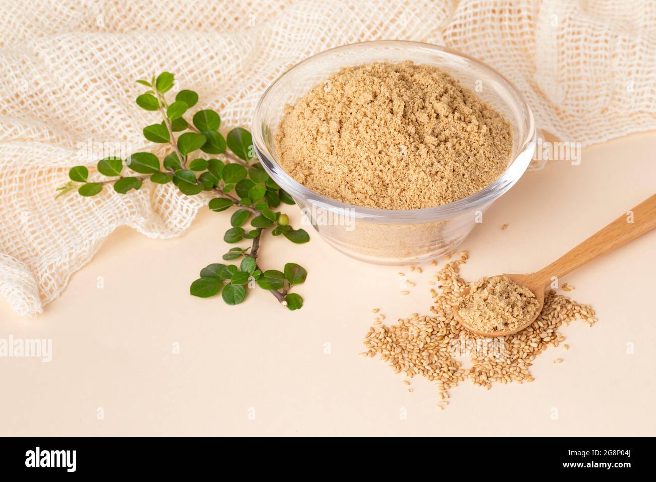 sesame powder in glass bowl with wood spoon Stock Photo - Alamy