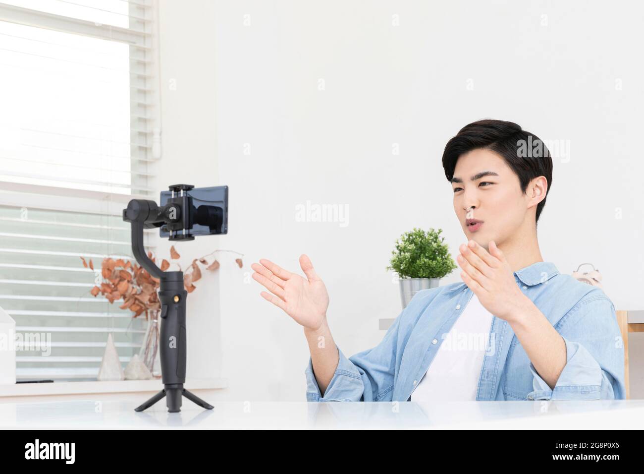 Young asian male content creator hi-res stock photography and images ...