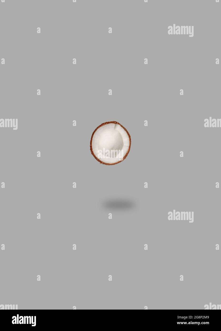 One ripe coconut on grey background. Flat lay, top view. Summer concept ...