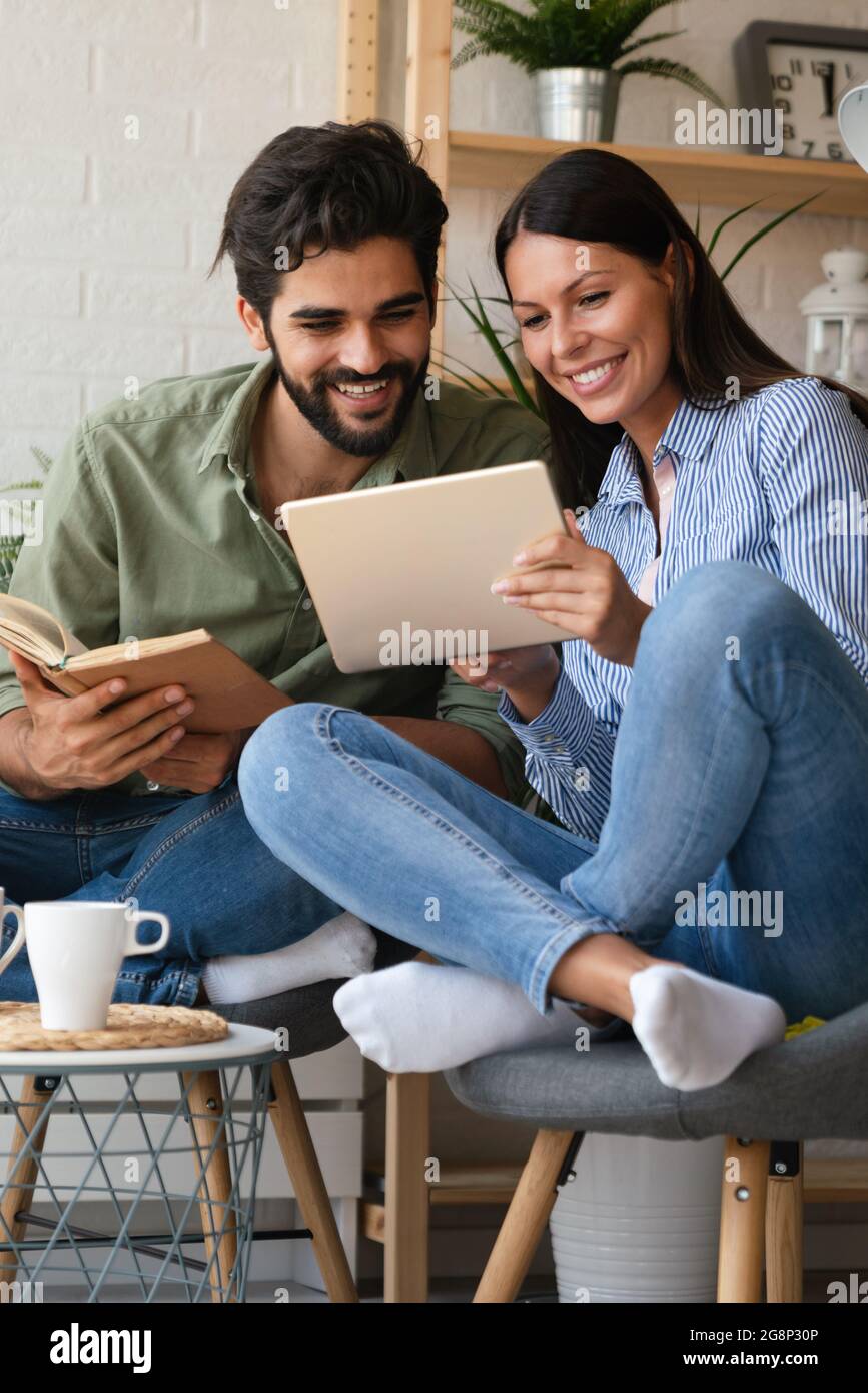 Spending nice time at home. Couple bonding to each other and smiling ...