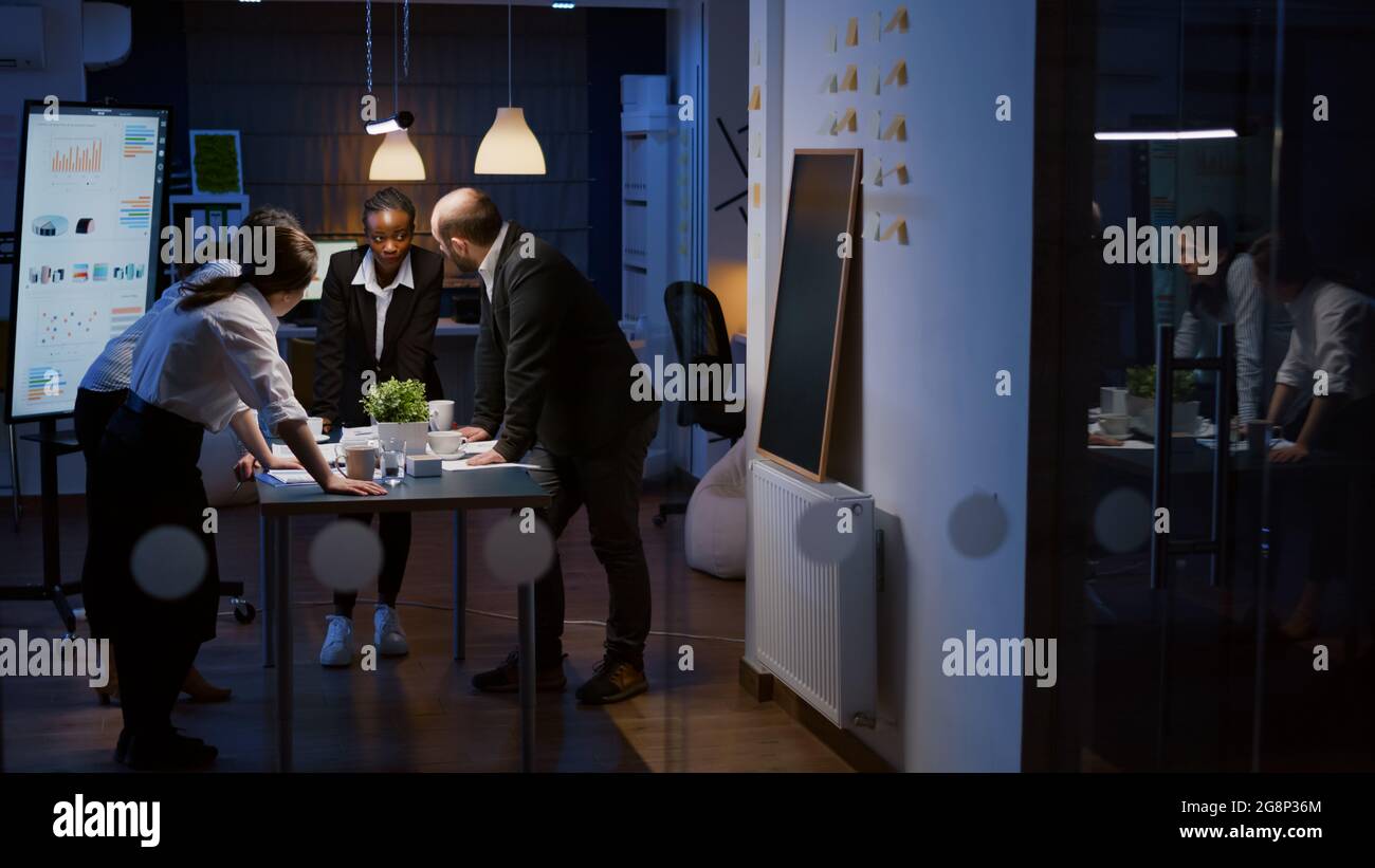 Diverse multi ethnic businesspeople teamwork lean on conference table ...