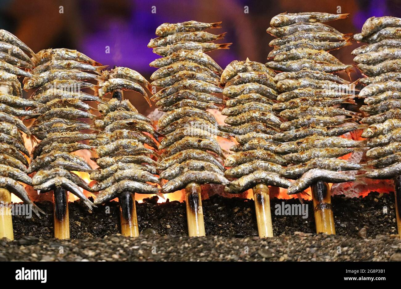 sardines to the fire on the beach Stock Photo - Alamy