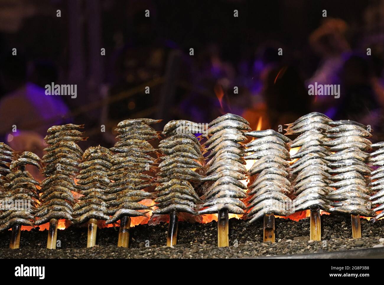sardines to the fire on the beach Stock Photo - Alamy