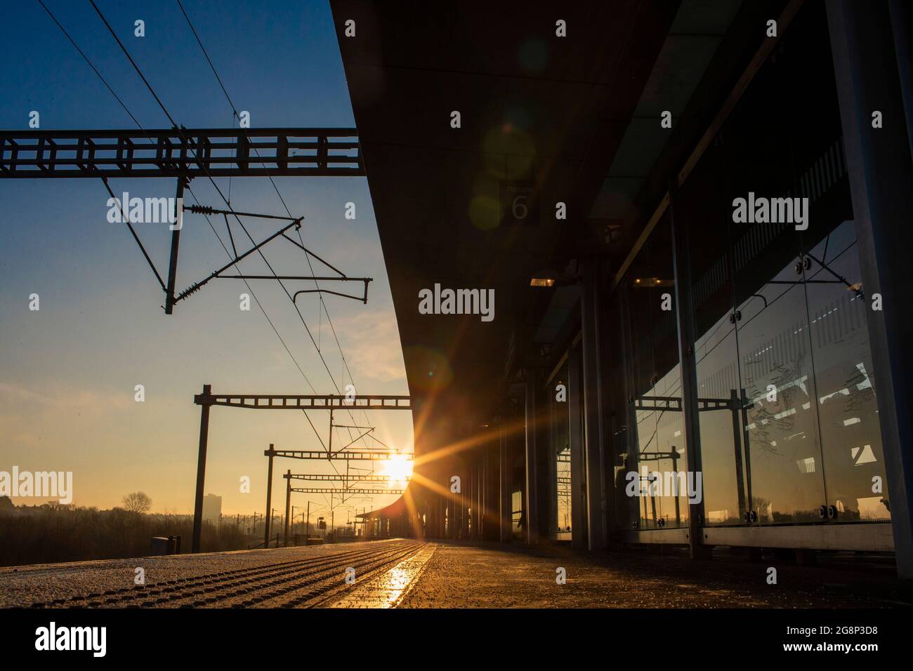 The sun rises on a icy gritted platform at Ebbsfleet International ...