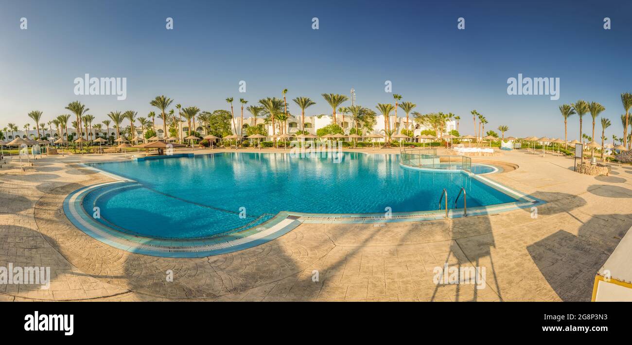 Panorama at beautiful swimming pool and palm trees in Egypt Stock Photo ...