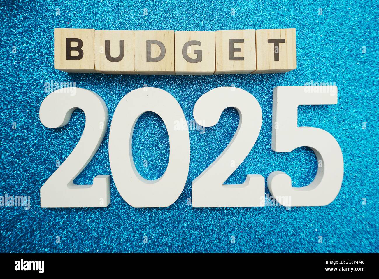 Budget 2025 alphabet letters on blue glitter background Stock Photo - Alamy