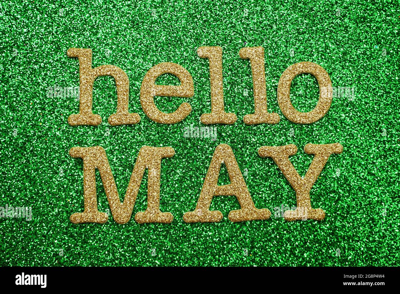 Hello May alphabet letters on green glitter background Stock Photo - Alamy