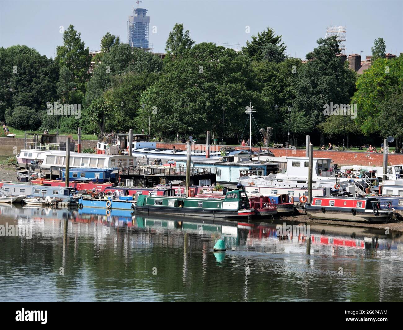 View across the River Thames to tow path and houseboats from ...