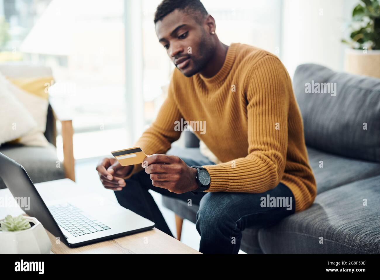 Shopping for all his essentials online Stock Photo - Alamy