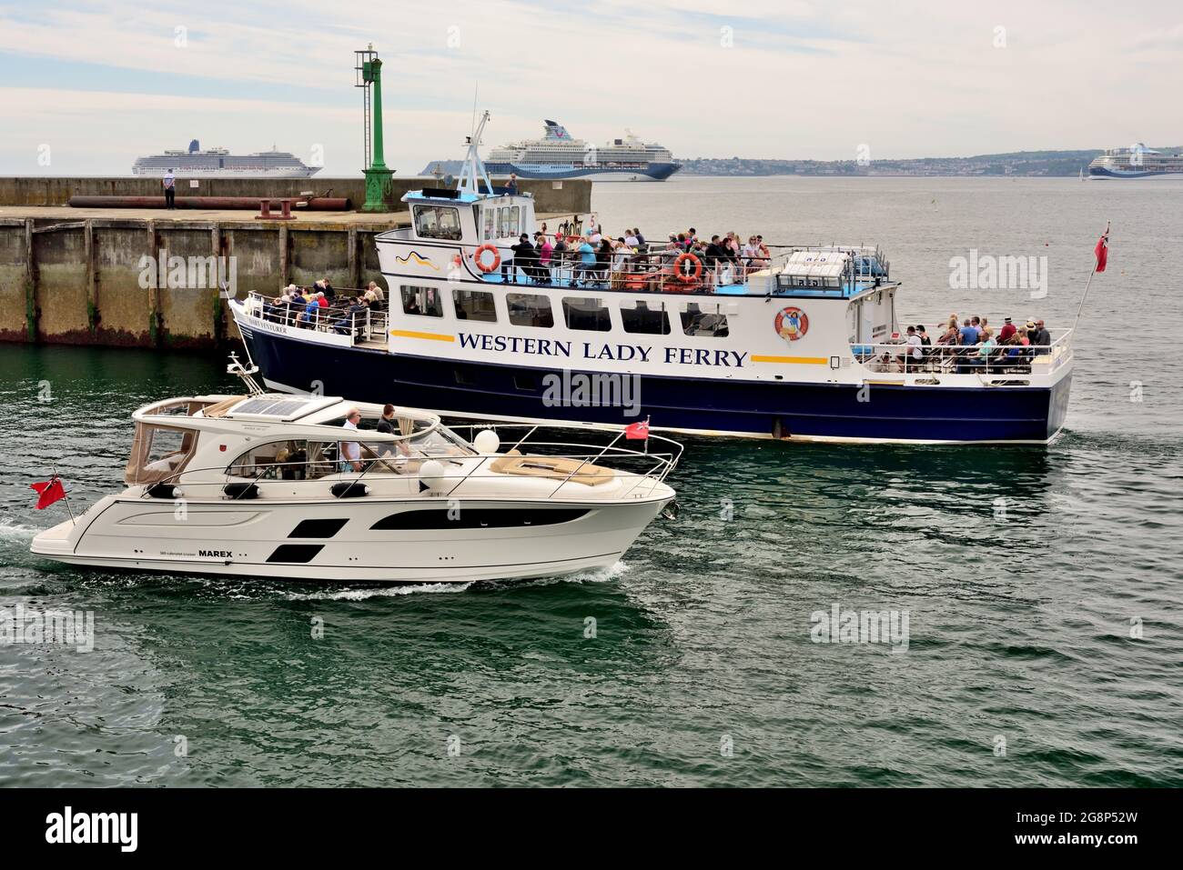 Western Lady Ferry Dart Venturer passes a cabin cruiser as it enters ...