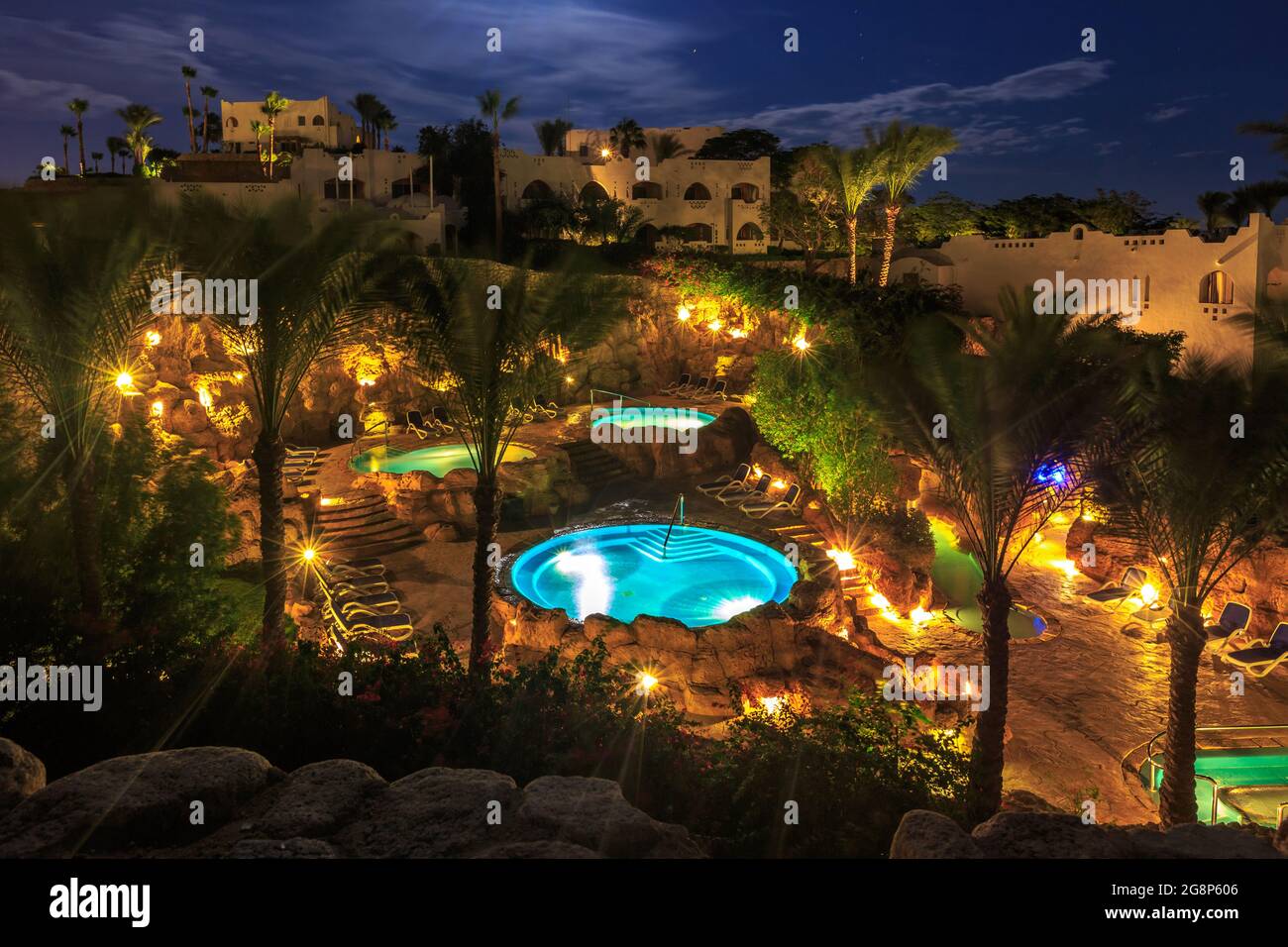 Evening view for luxury swimming pools in night illumination Stock ...