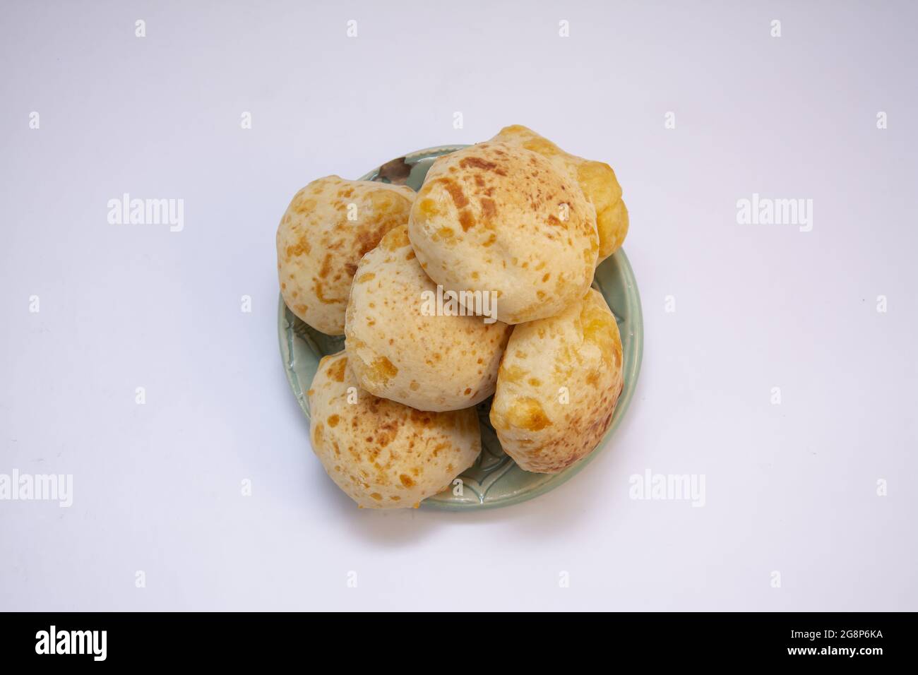 Top view of a clay plate on an isolated white background with ...