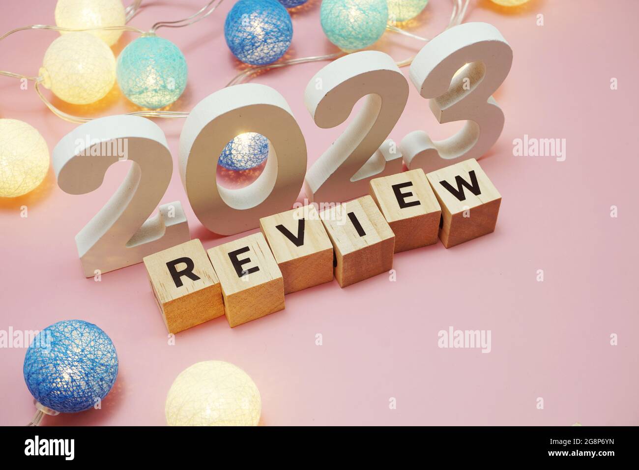 Review 2023 word alphabet letters on pink background Stock Photo - Alamy