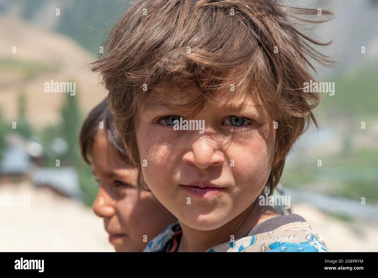 Bandipora, India. 22nd July, 2021. A dard girl looks on as she poses ...
