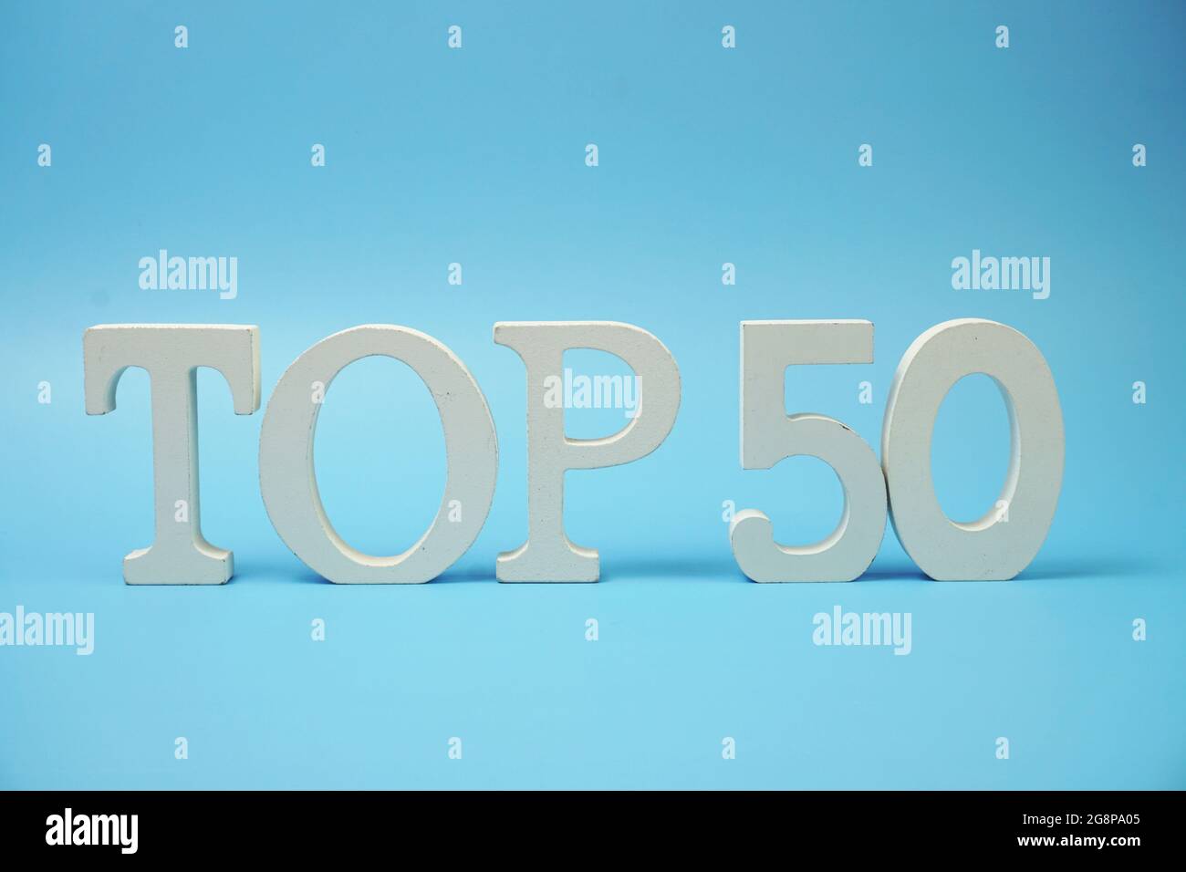 Top 50 alphabet letters on blue background Stock Photo - Alamy