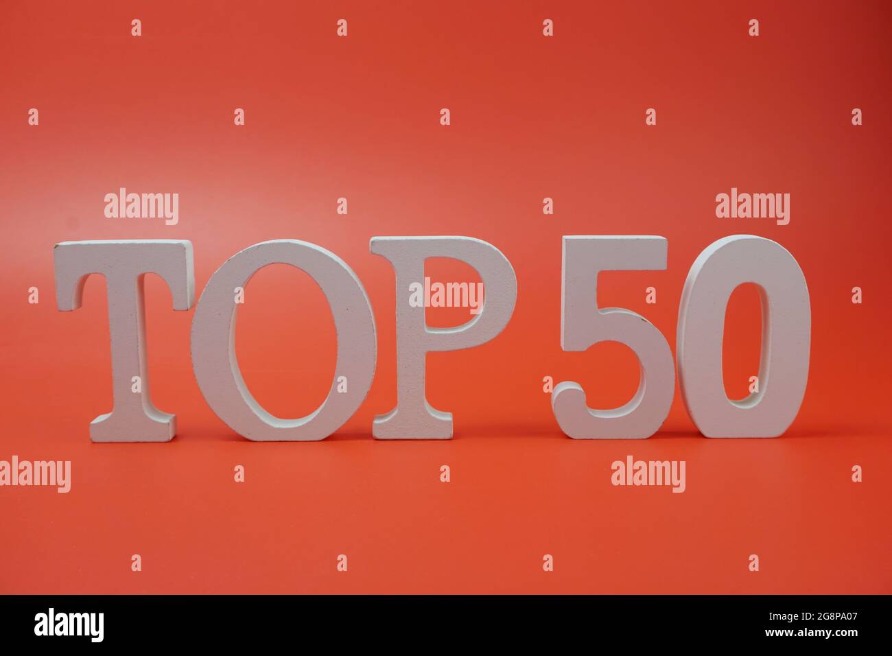 Top 50 alphabet letters on red background Stock Photo - Alamy