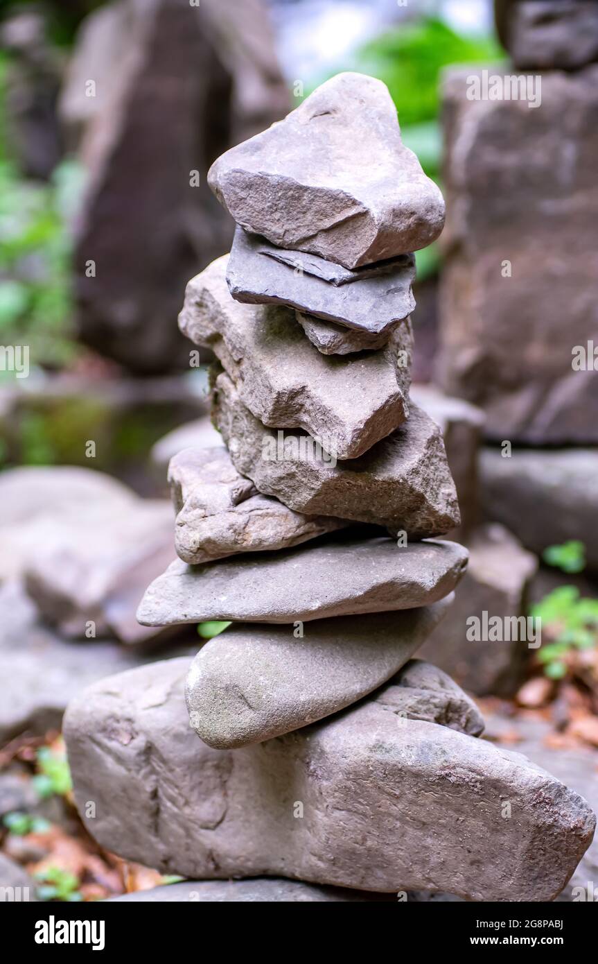 Close-up of a stack of stones in perfect balance in a mountain forest ...