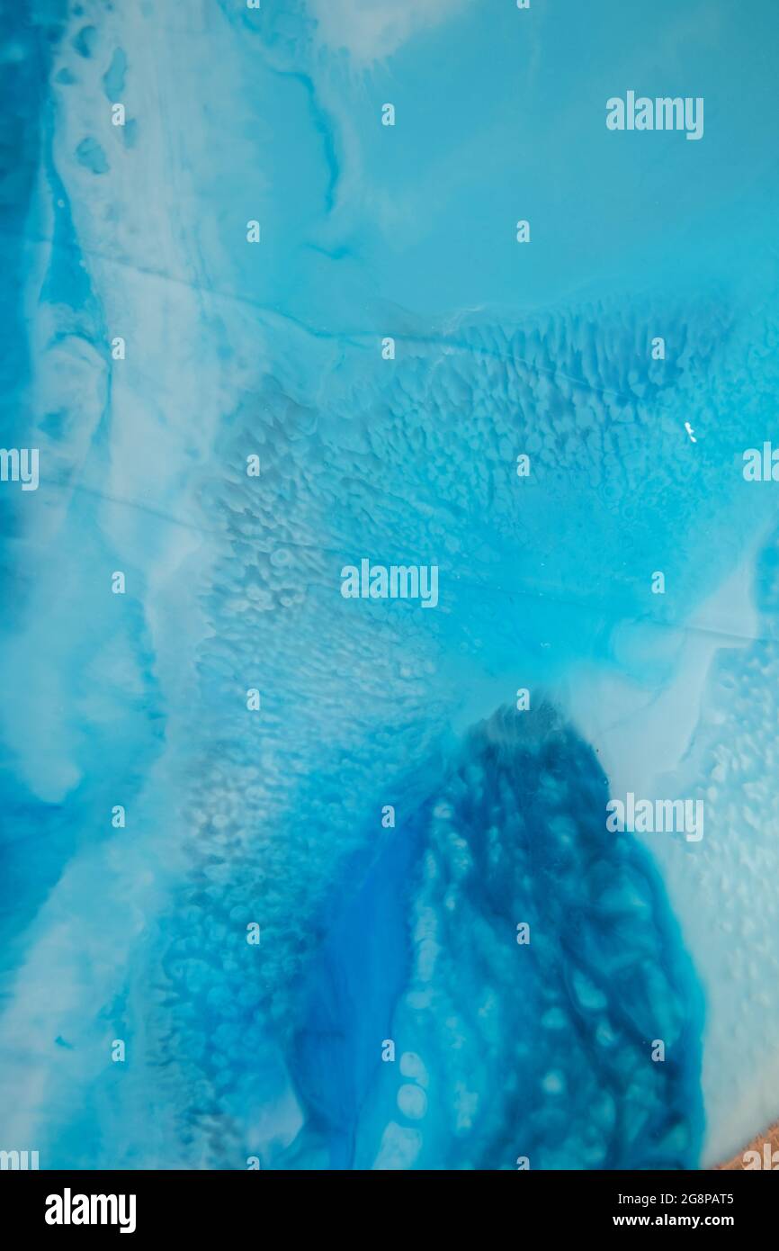 Macro photo of colourful abstract epoxy resin painting. Applicable for ...