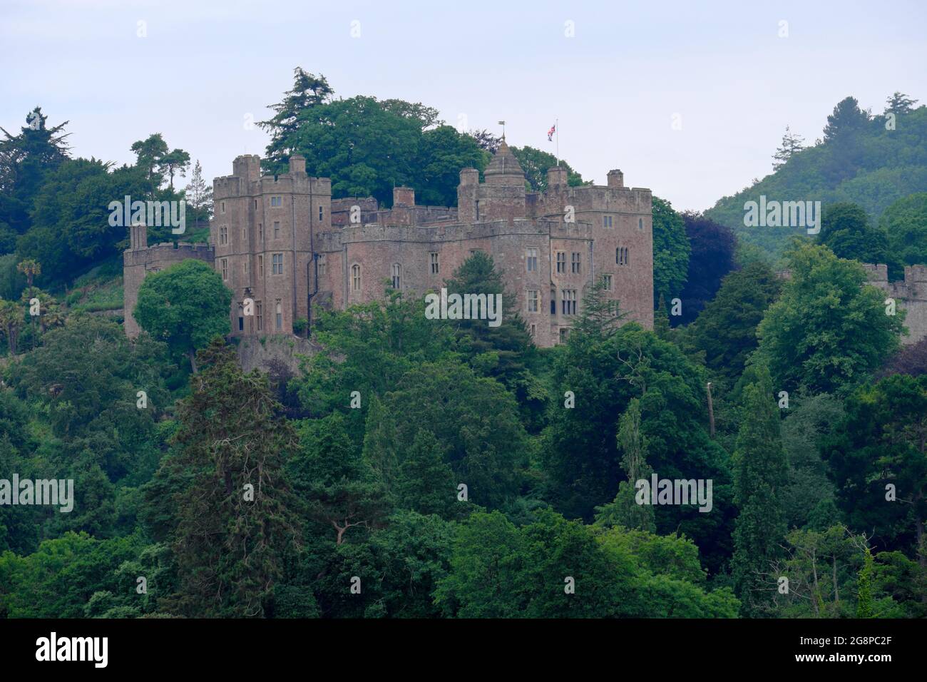 Dunster Castle Rises Above The Trees In Dunster Somerset England UK ...