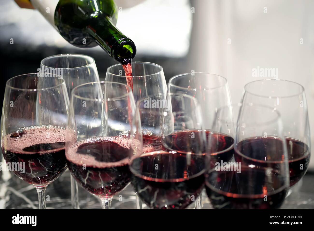 Pouring wine many glasses hi-res stock photography and images - Alamy