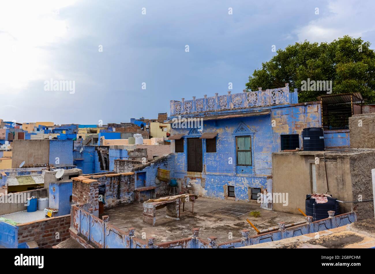 JODHPUR, RAJASTHAN, INDIA - JULY 2021: The bright blue color street and ...