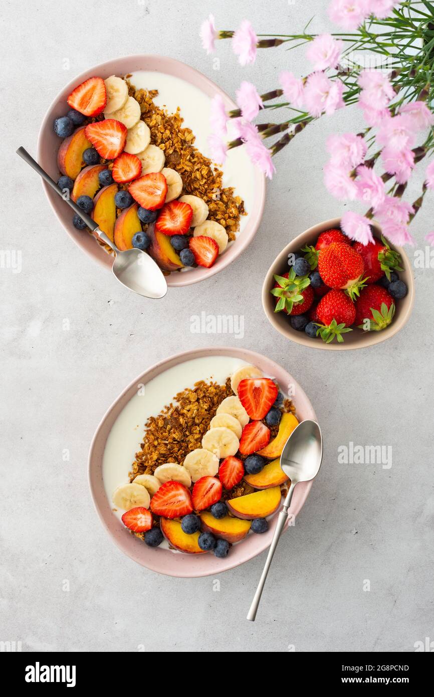 Delicious healthy breakfast, granola with yogurt and sweet fruit ...