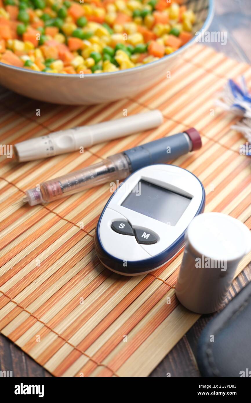 diabetic measurement tools and healthy food on table Stock Photo - Alamy