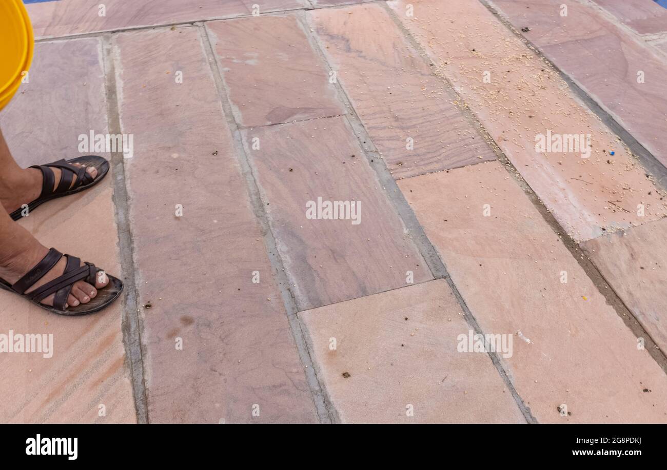 JODHPUR, RAJASTHAN, INDIA - JULY 2021: The bright blue color street and ...