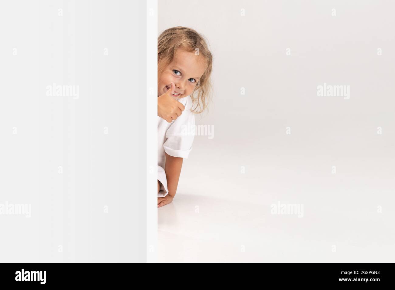 Child Peeking Around Corner