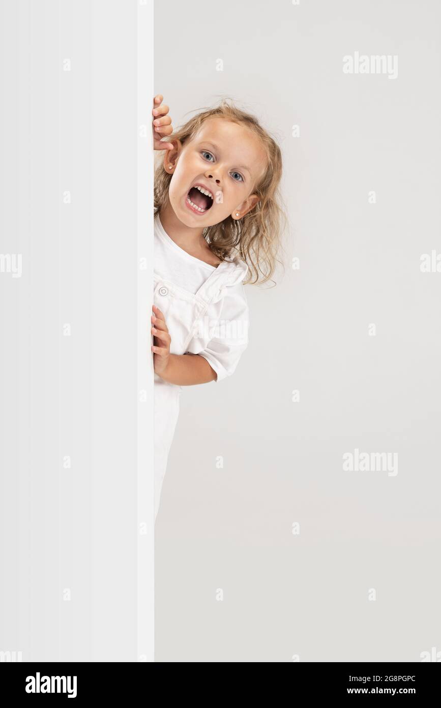 Child Peeking Around Corner