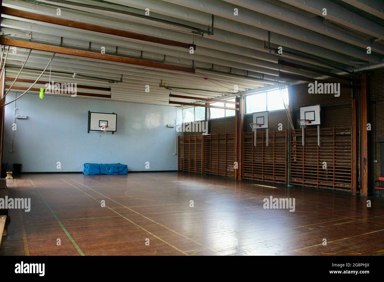 an empty classic wooden style gymnasium in an english secondary school ...