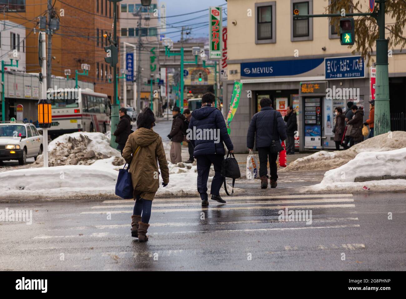 Otaru, Japan - December 25, 2017: Unidentified pedestrians walk in ...