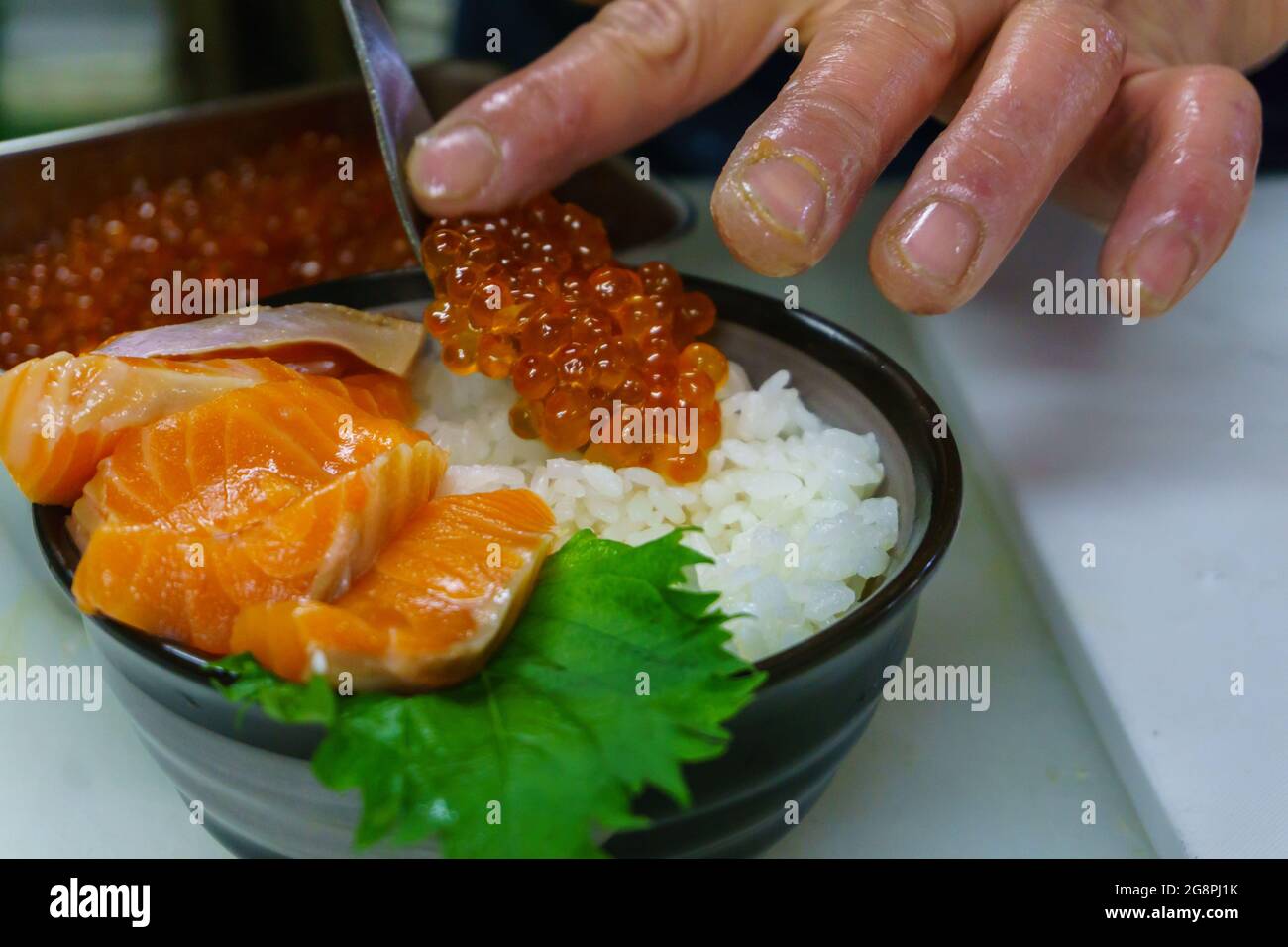 Fresh Seafood bowl in a seafood market in Japan. a sea urchin's gonads ...