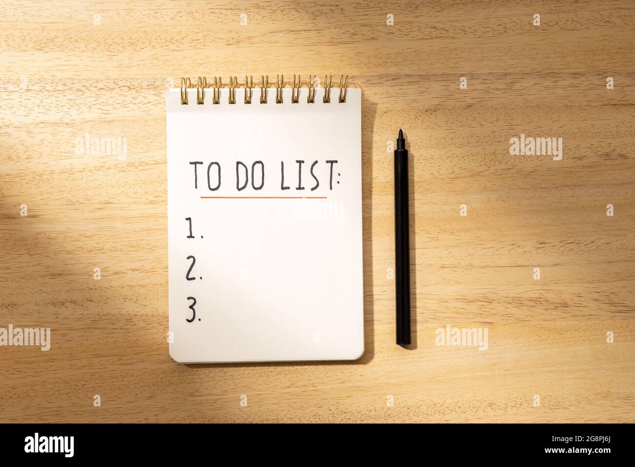 To do list in spiral notepad isolated on wooden desk. Flat lay Stock ...