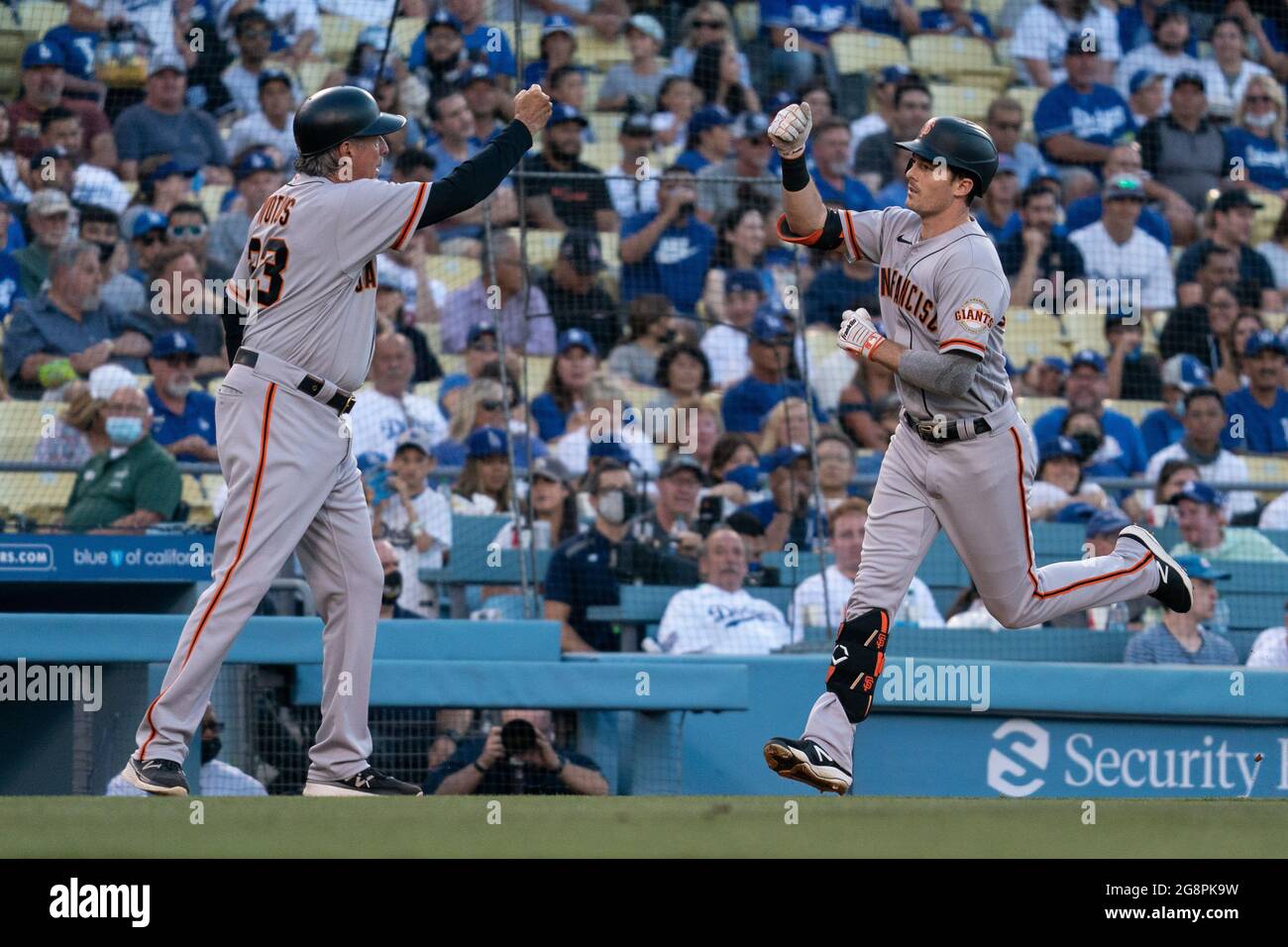 San Francisco Giants third base coach Ron Wotus (23) congratulates ...