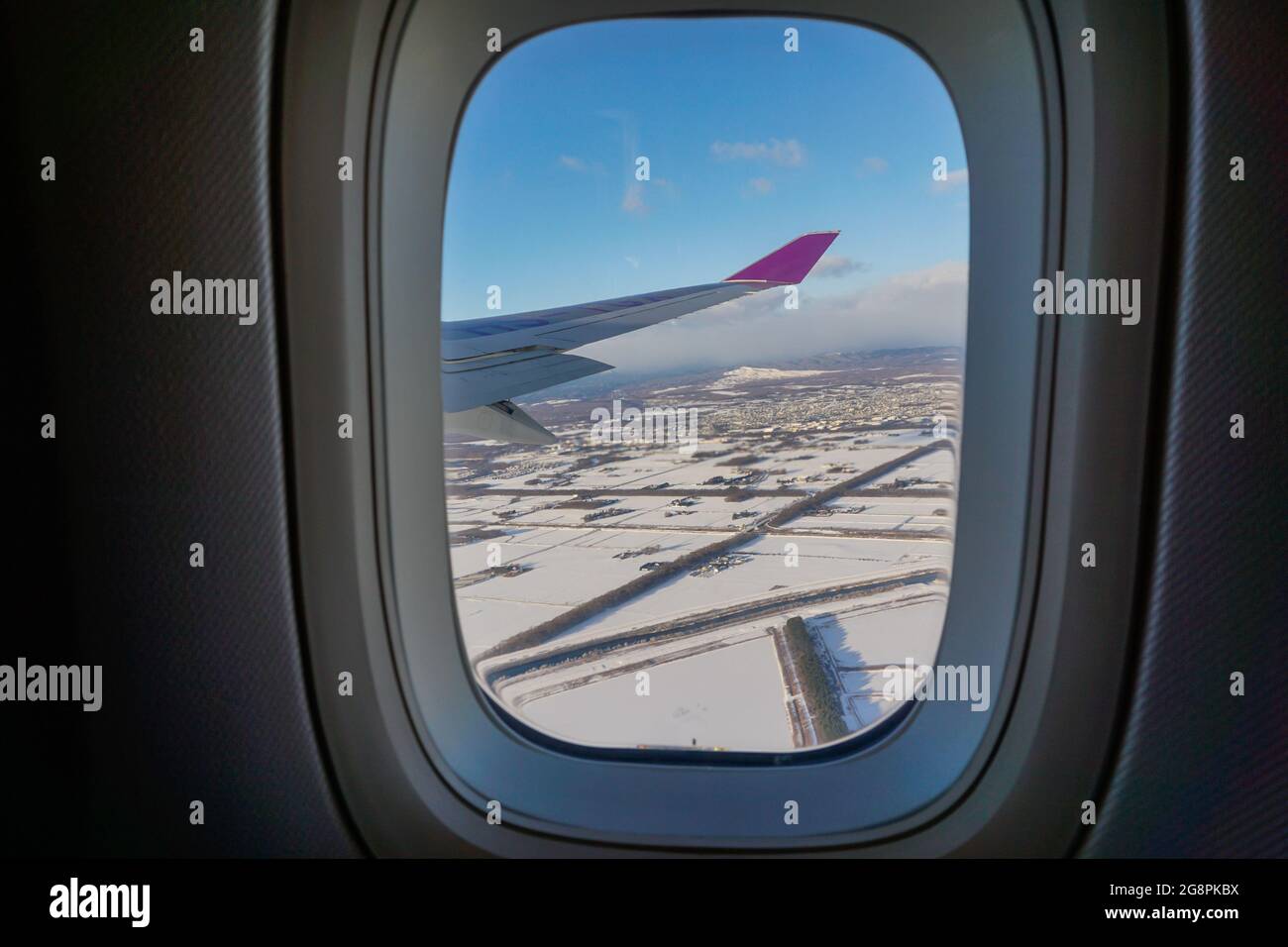 The aircraft wing view from inside aircraft with the clear blue sly ...