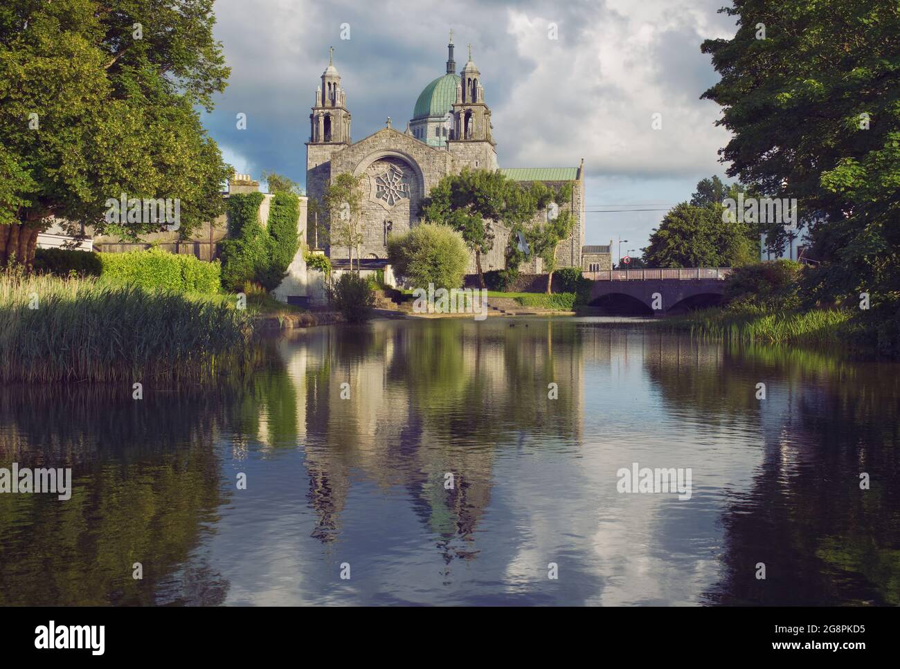 Beautiful cityscape with Galway cathedral reflected in Corrib river at ...