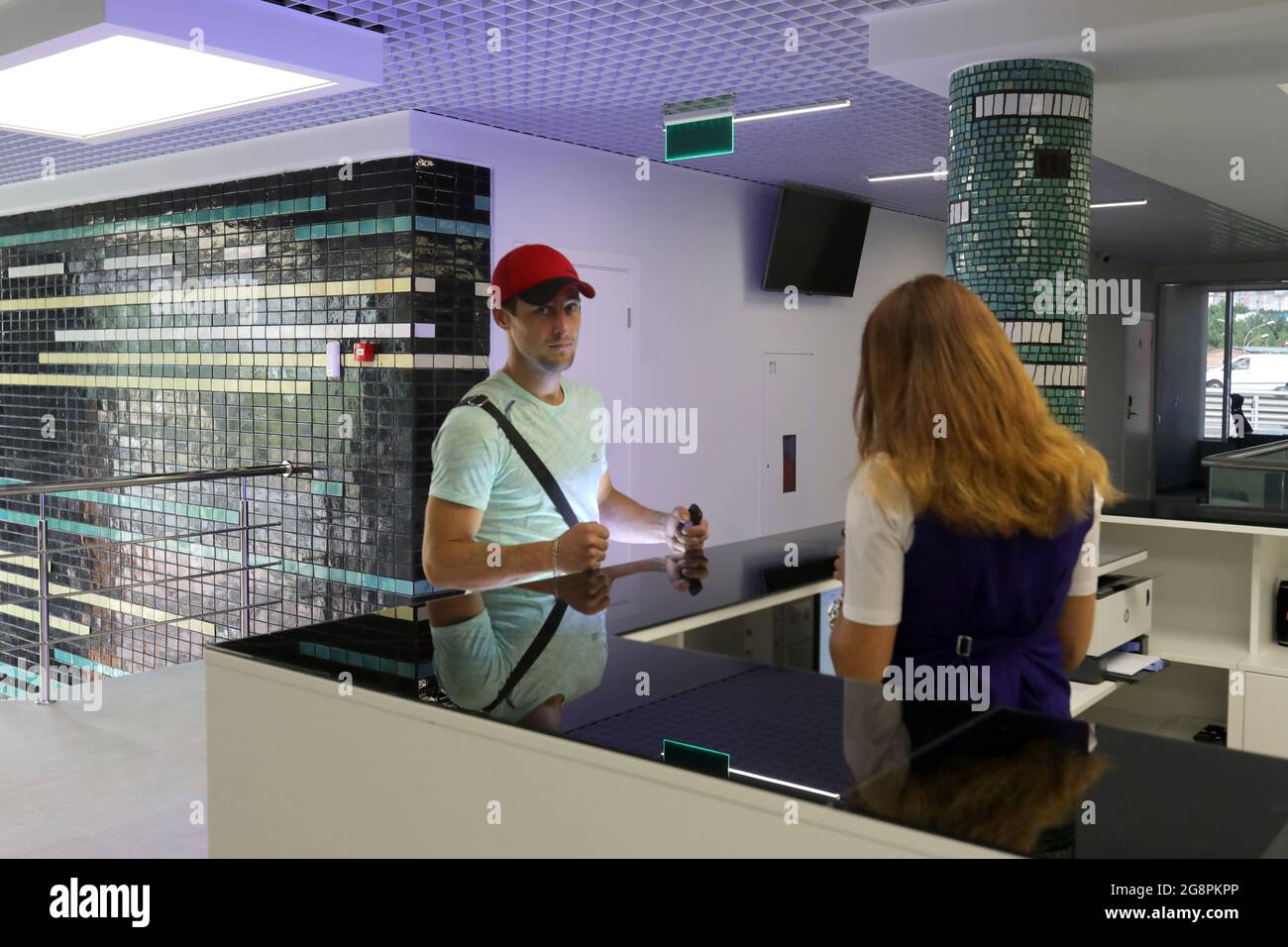 KYIV, UKRAINE - JULY 22, 2021 - A man stands behind a desk at the ...