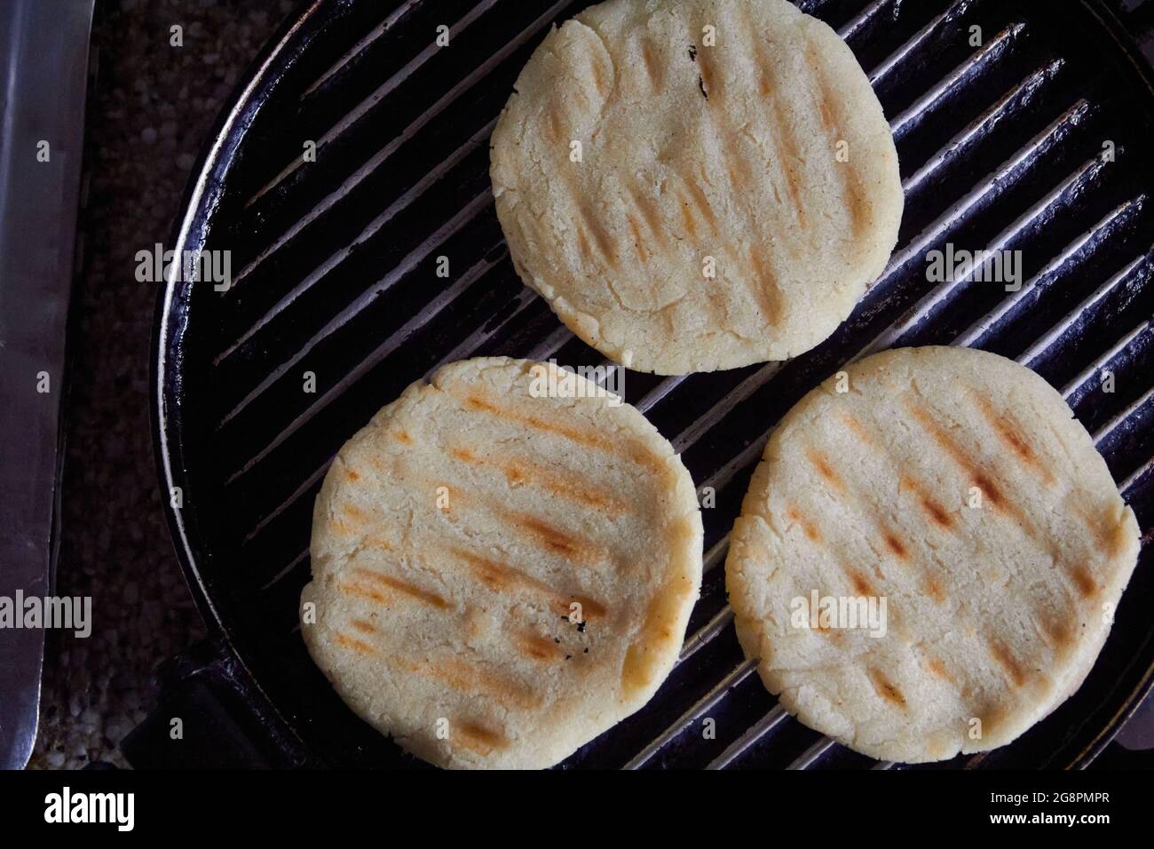 Arepas at Latin America kitchen Stock Photo - Alamy