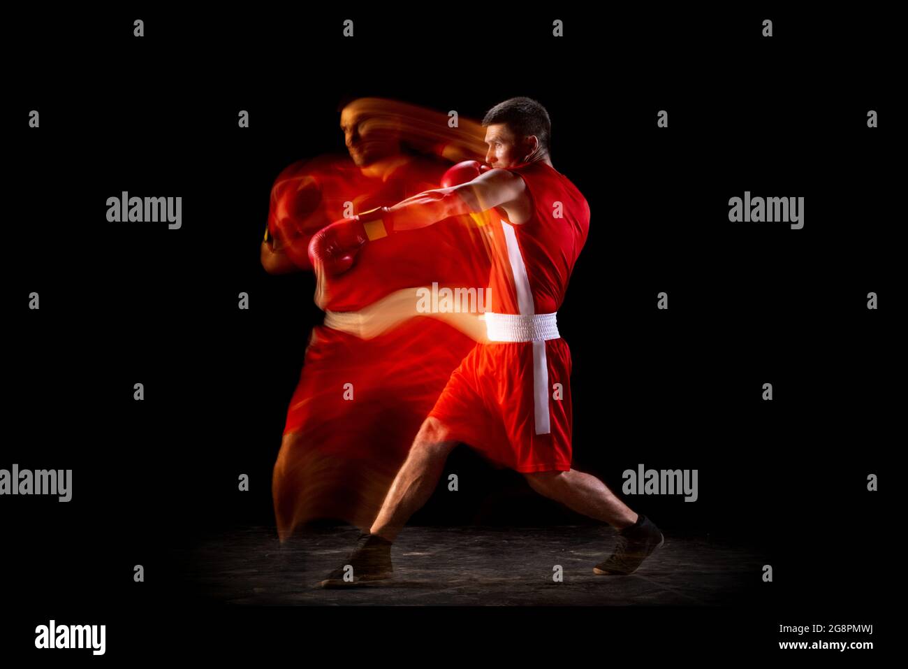 Full length portrait of one professional boxer in action, motion over ...