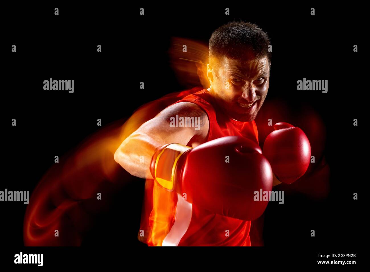 Half-length portrait of one professional male boxer in motion, action ...