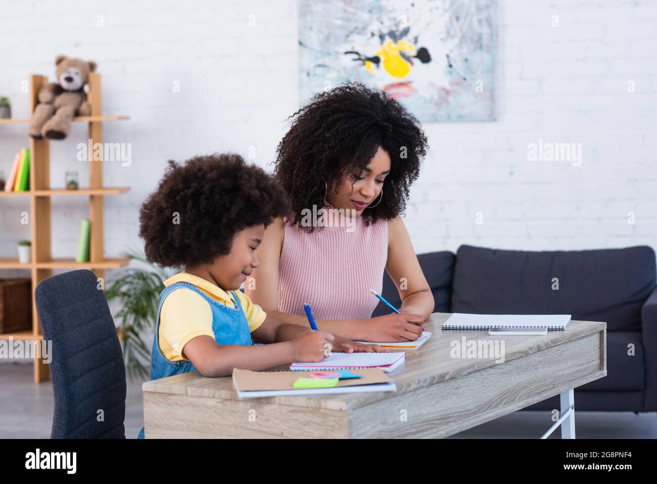 African mother child school books hi-res stock photography and images ...