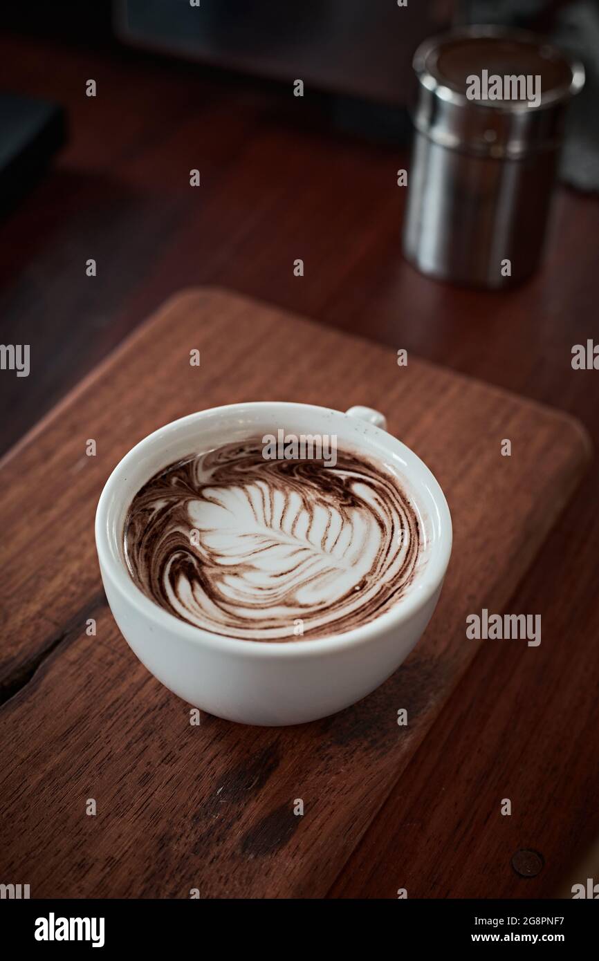 Selective focus cup of hot latte art coffee,focus at white foam Stock ...