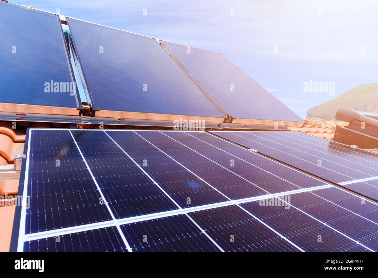 Renewable energy system with solar panel for electricity and hot water ...