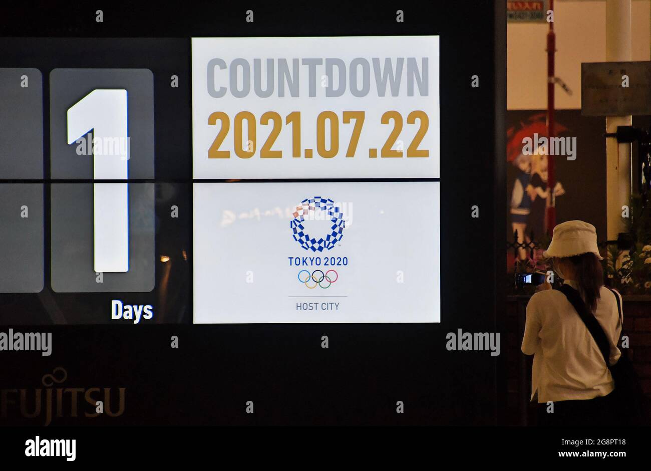 Tokyo, Japan. 22nd July, 2021. Pedestrians take photo the countdown ...