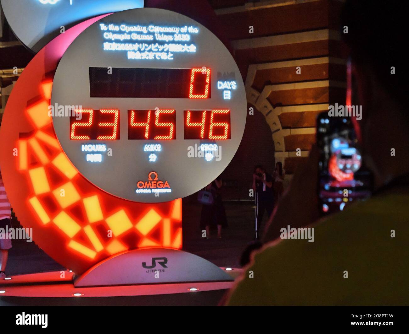 Tokyo, Japan. 22nd July, 2021. Pedestrians take photo the countdown ...
